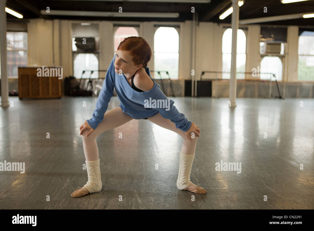 Ballet dancer warming up in dance studio Stock Photo - Alamy