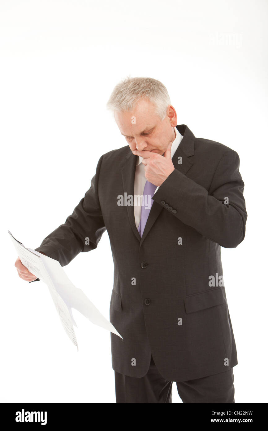 Confused businessman reading documents hi-res stock photography and ...