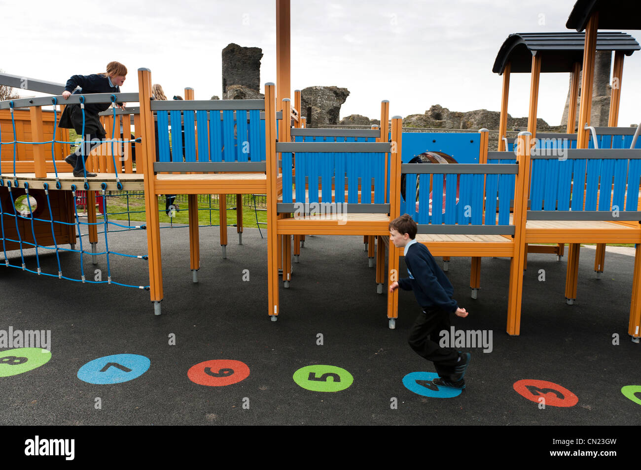 primary school children using a newly opened adventure playground ...
