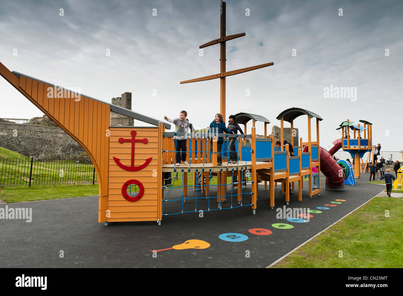 primary school children using a newly opened adventure playground ...