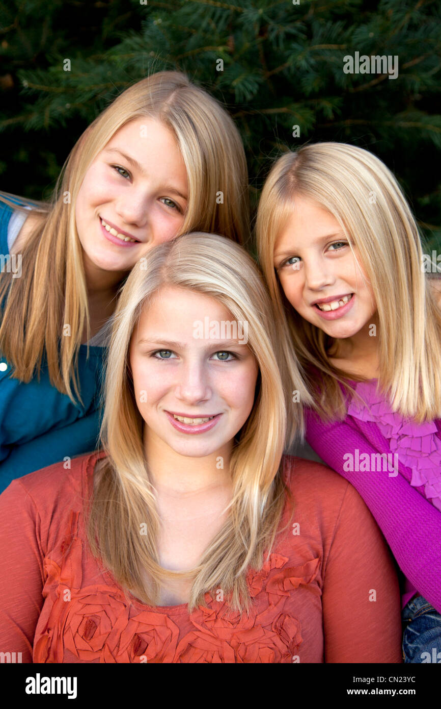 Three Smiling Blond Girls Stock Photo - Alamy