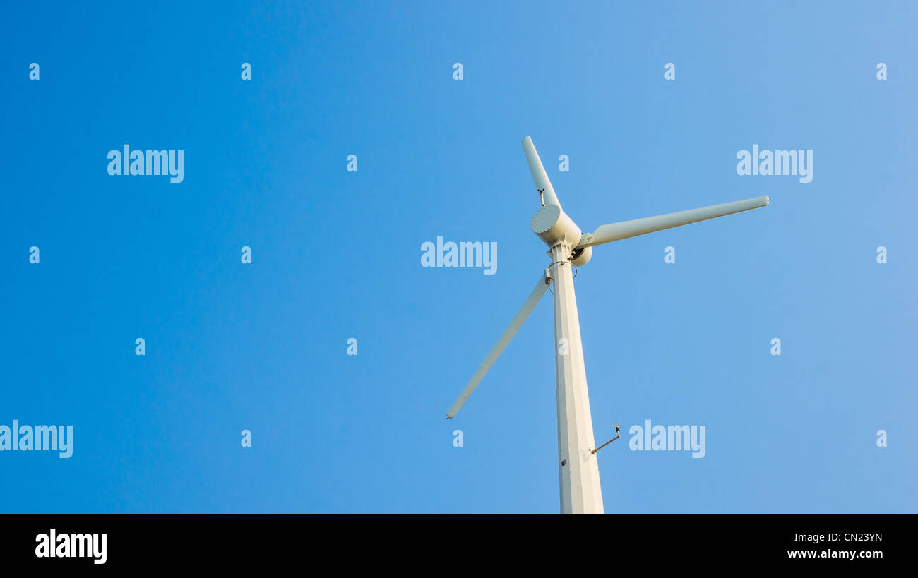 white wind turbine electricity on blue sky Stock Photo - Alamy