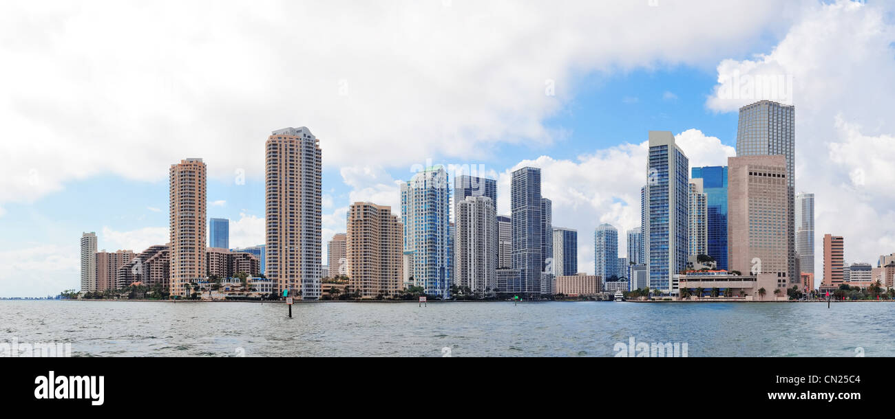Miami skyline panorama in the day with urban skyscrapers and cloudy sky ...
