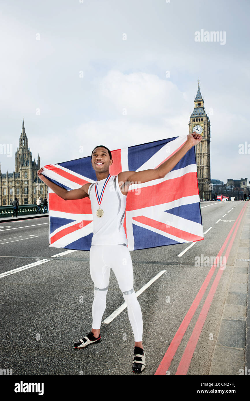 Olympic gold medal winner with Union Jack Stock Photo - Alamy