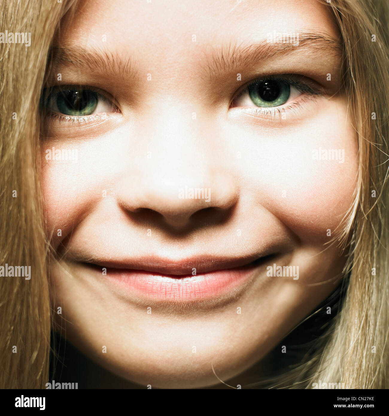 Studio portrait of charming smiling little girl Stock Photo - Alamy