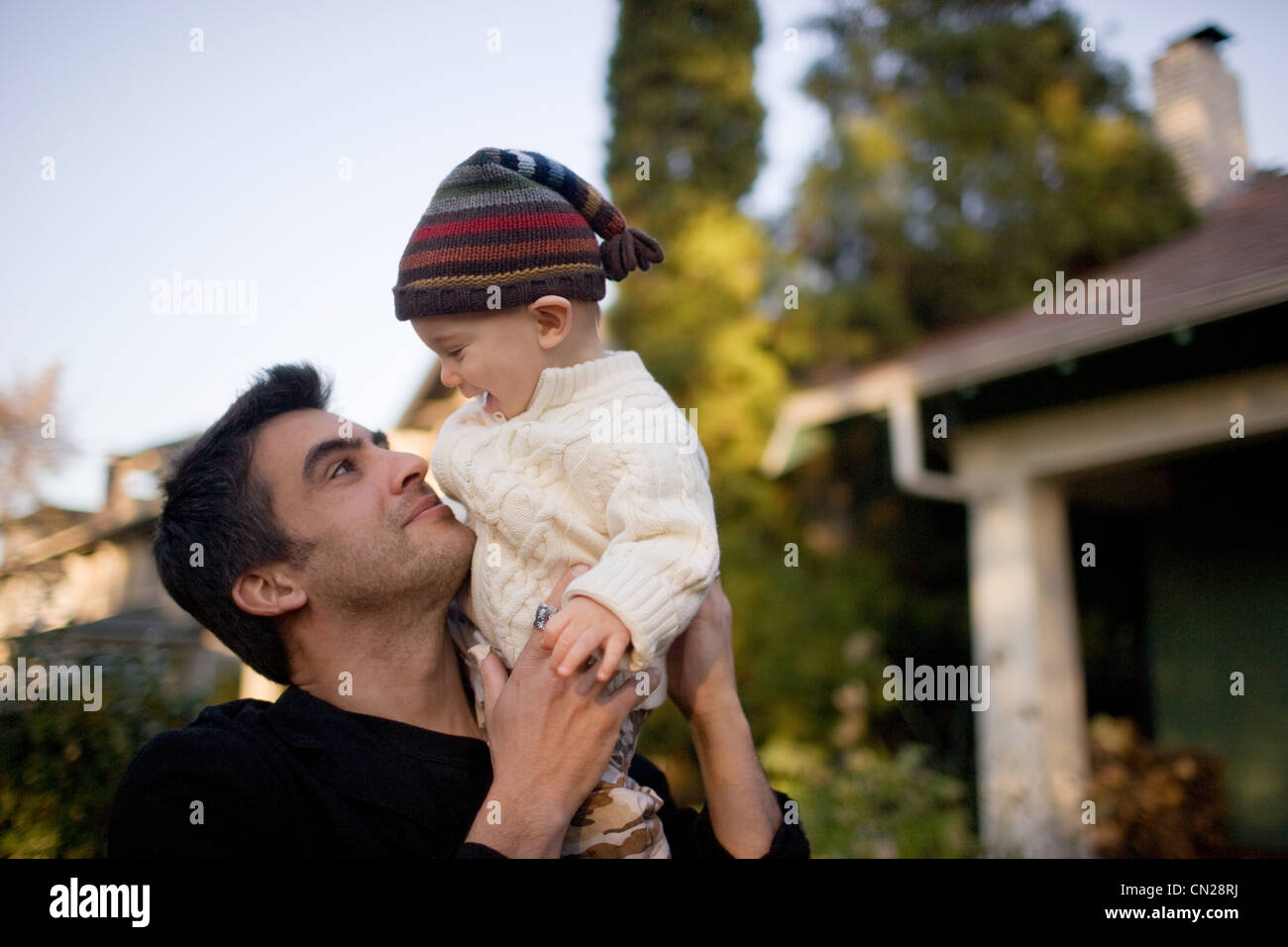 Father carrying toddler son Stock Photo - Alamy