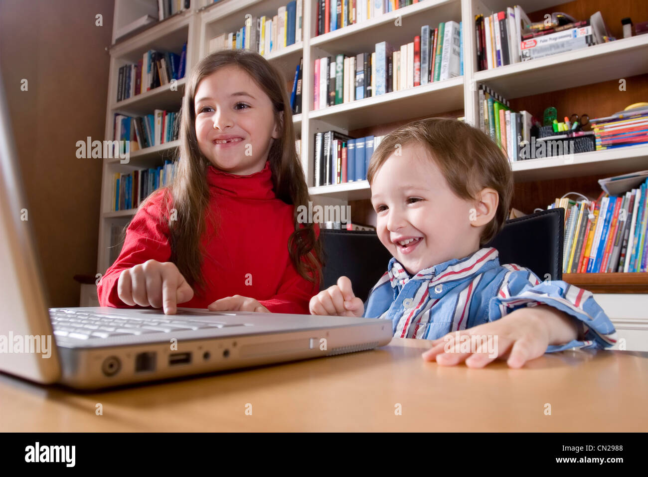 Brother and Sister on a Laptop Computer, Toronto, Ontario Stock Photo ...