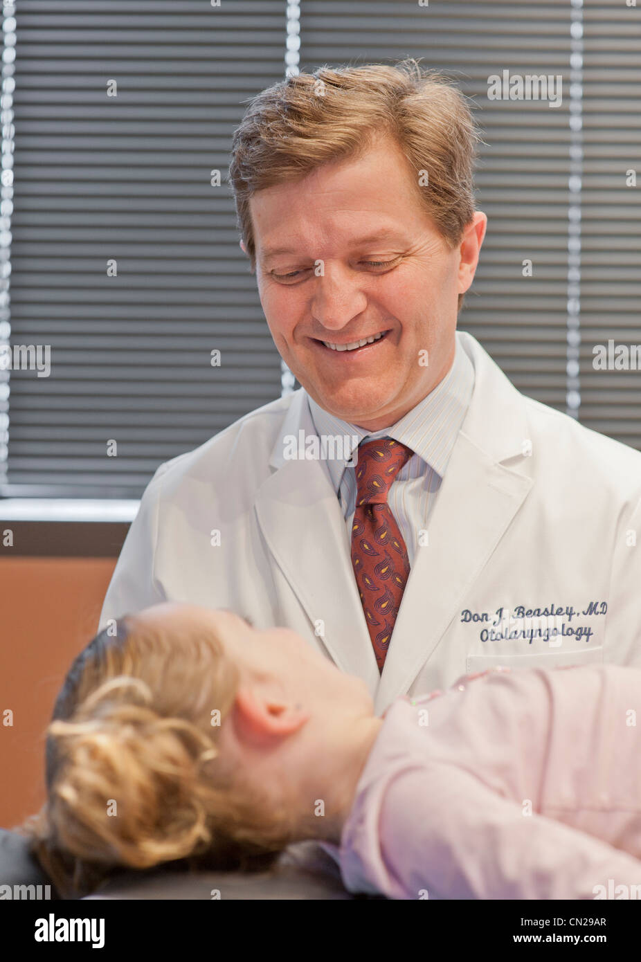 A doctor works with patients at his office Stock Photo - Alamy