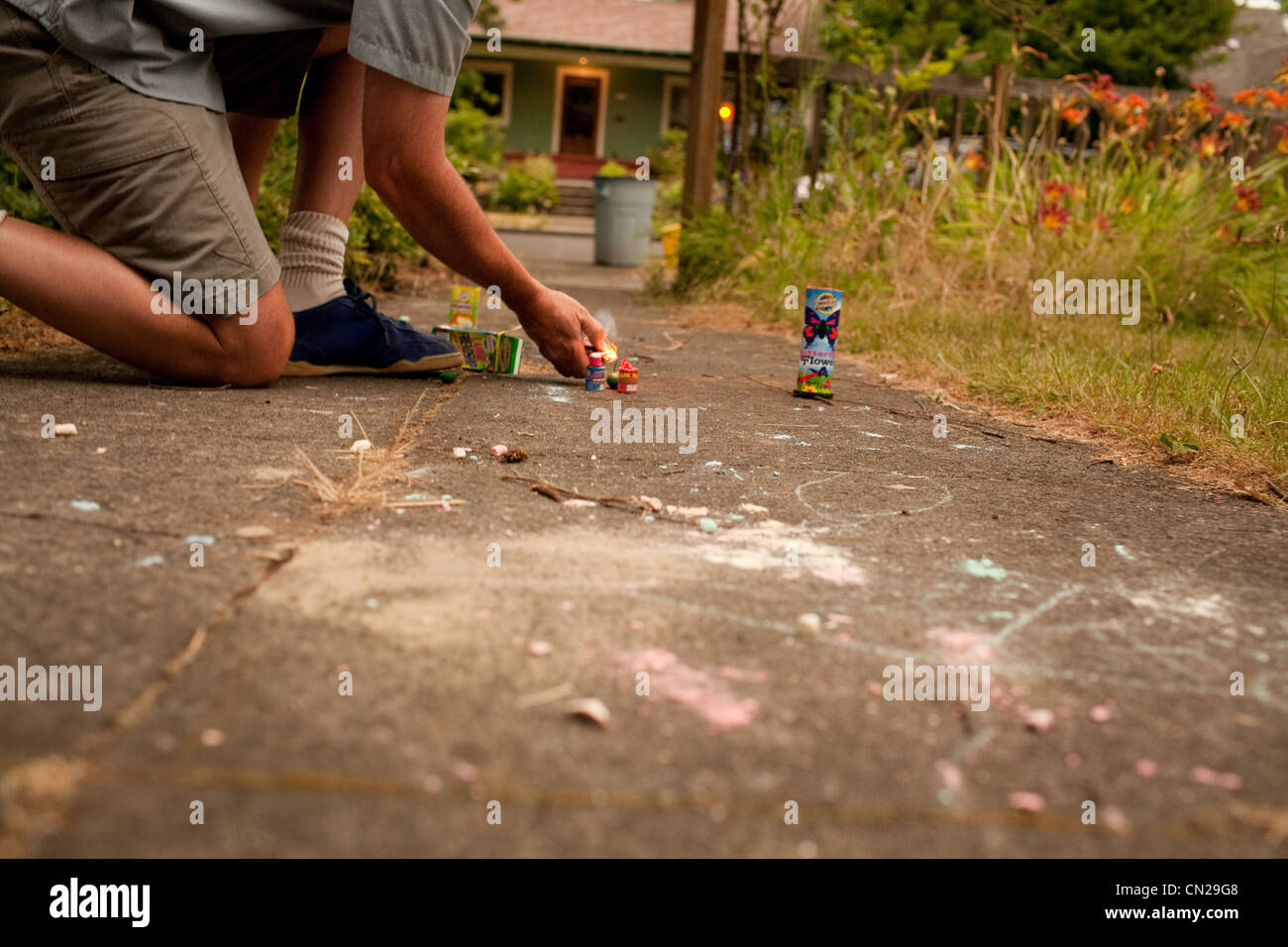 Man lighting fireworks Stock Photo - Alamy