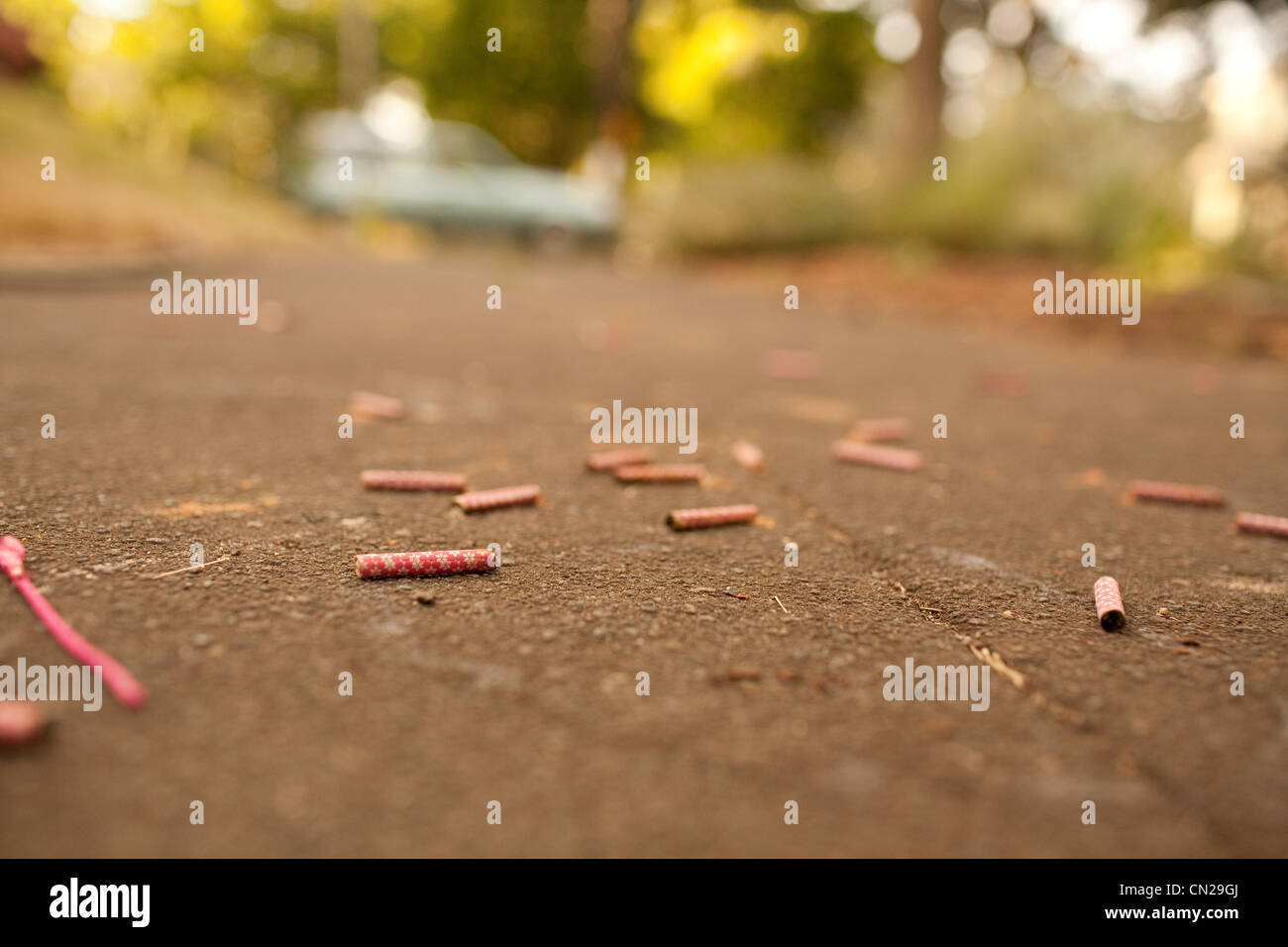 Used fireworks on road Stock Photo - Alamy