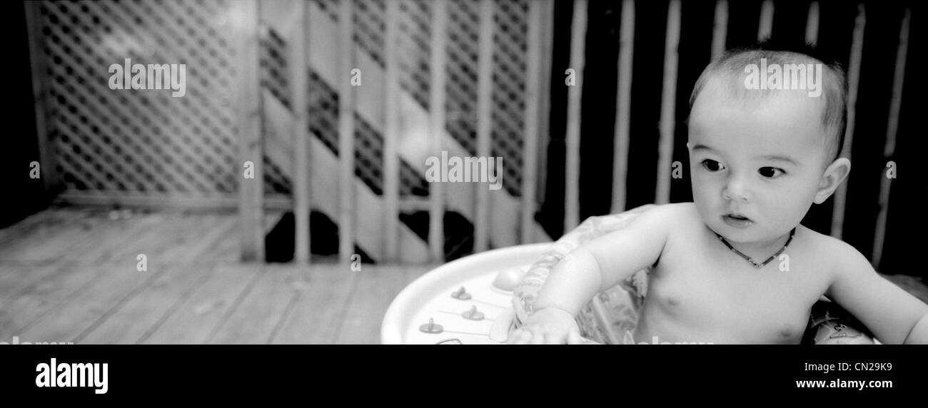 Baby Boy in an Exersaucer on a Deck, Montreal, Quebec Stock Photo - Alamy