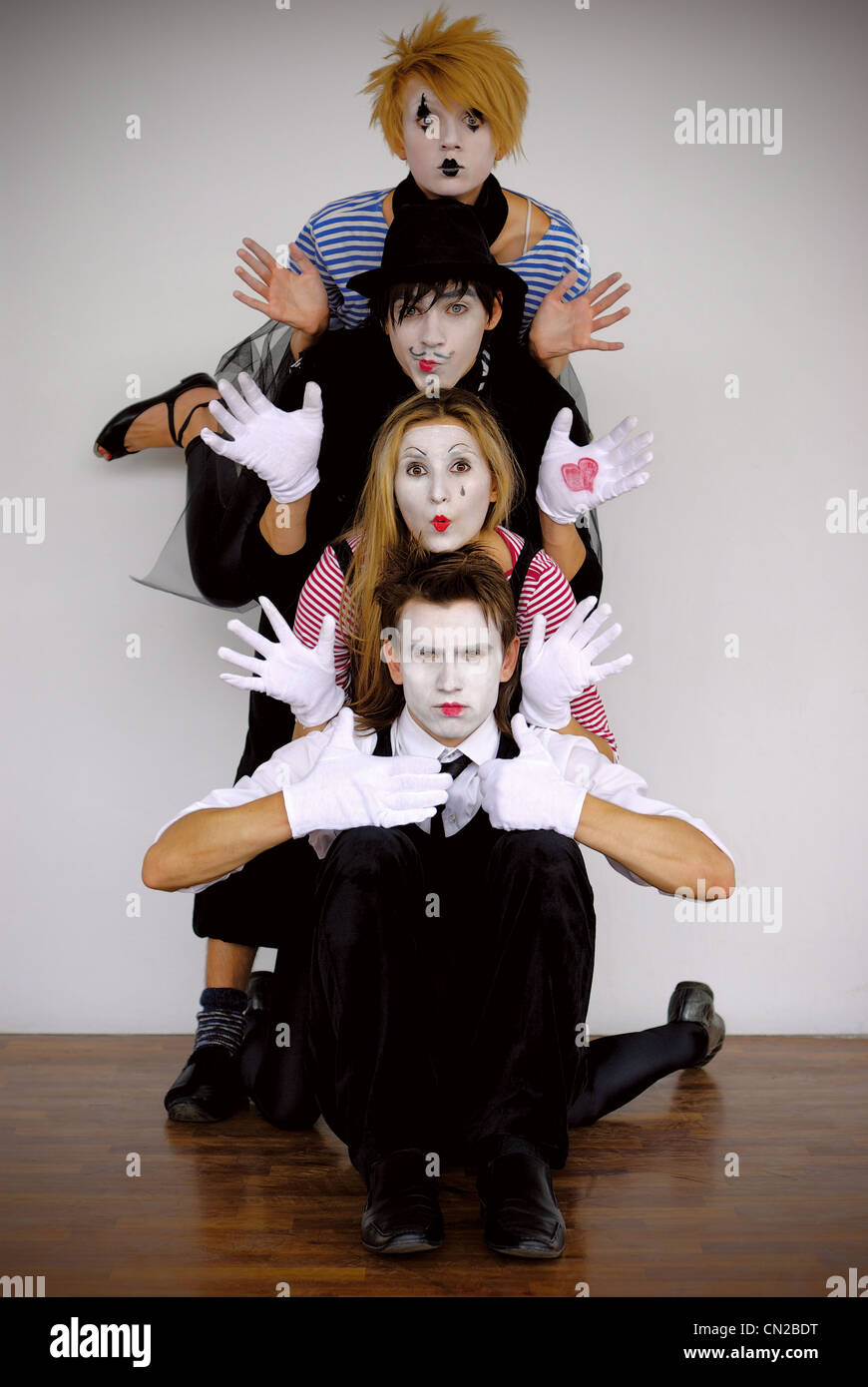 four mime actors in action Stock Photo - Alamy