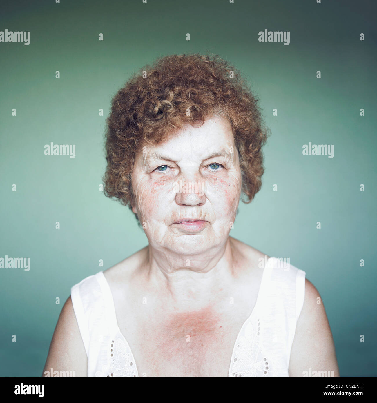 Gracious senior lady portrait on green background Stock Photo - Alamy