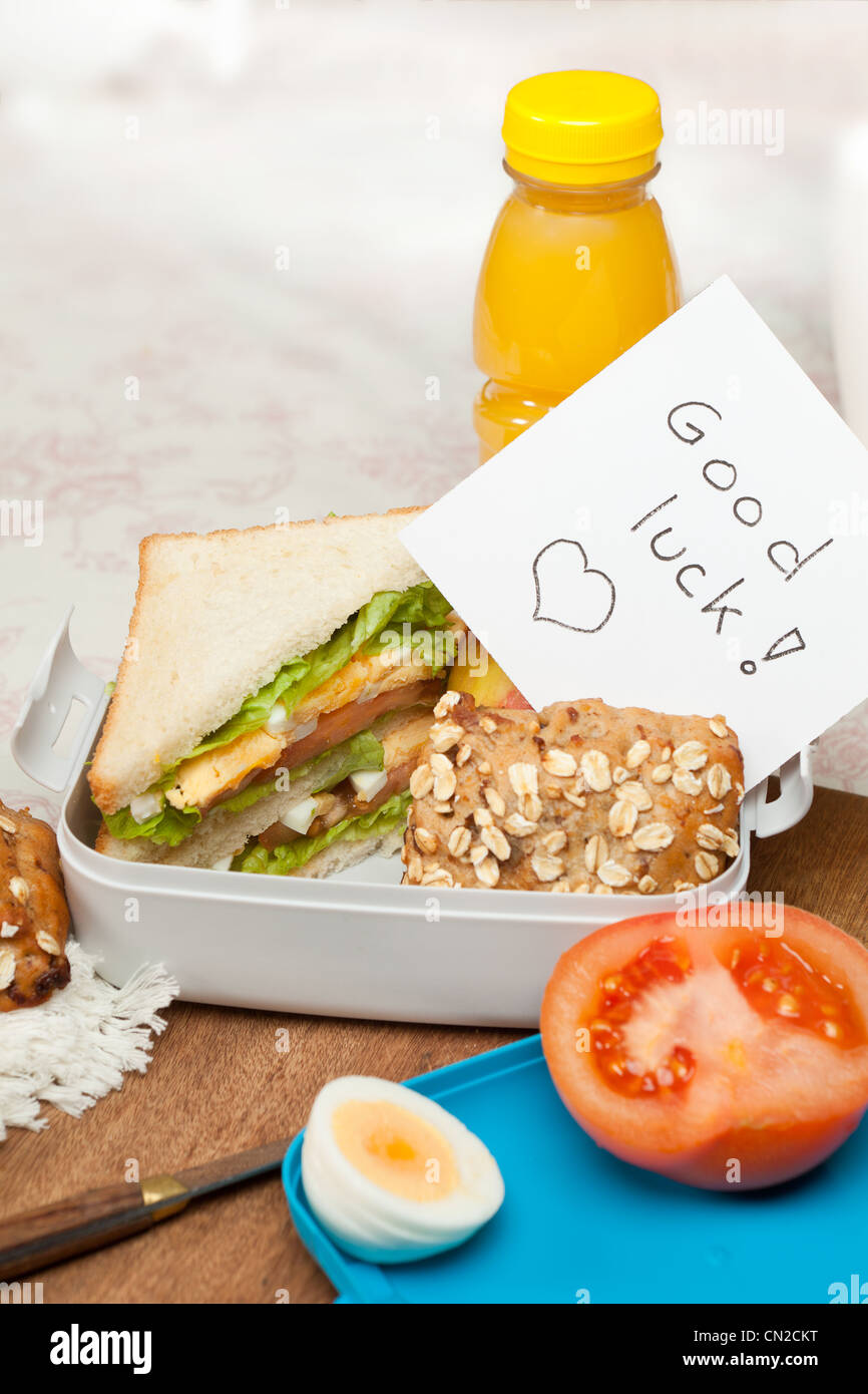 Lunch-box with good luck note for graduation or first day at work or ...