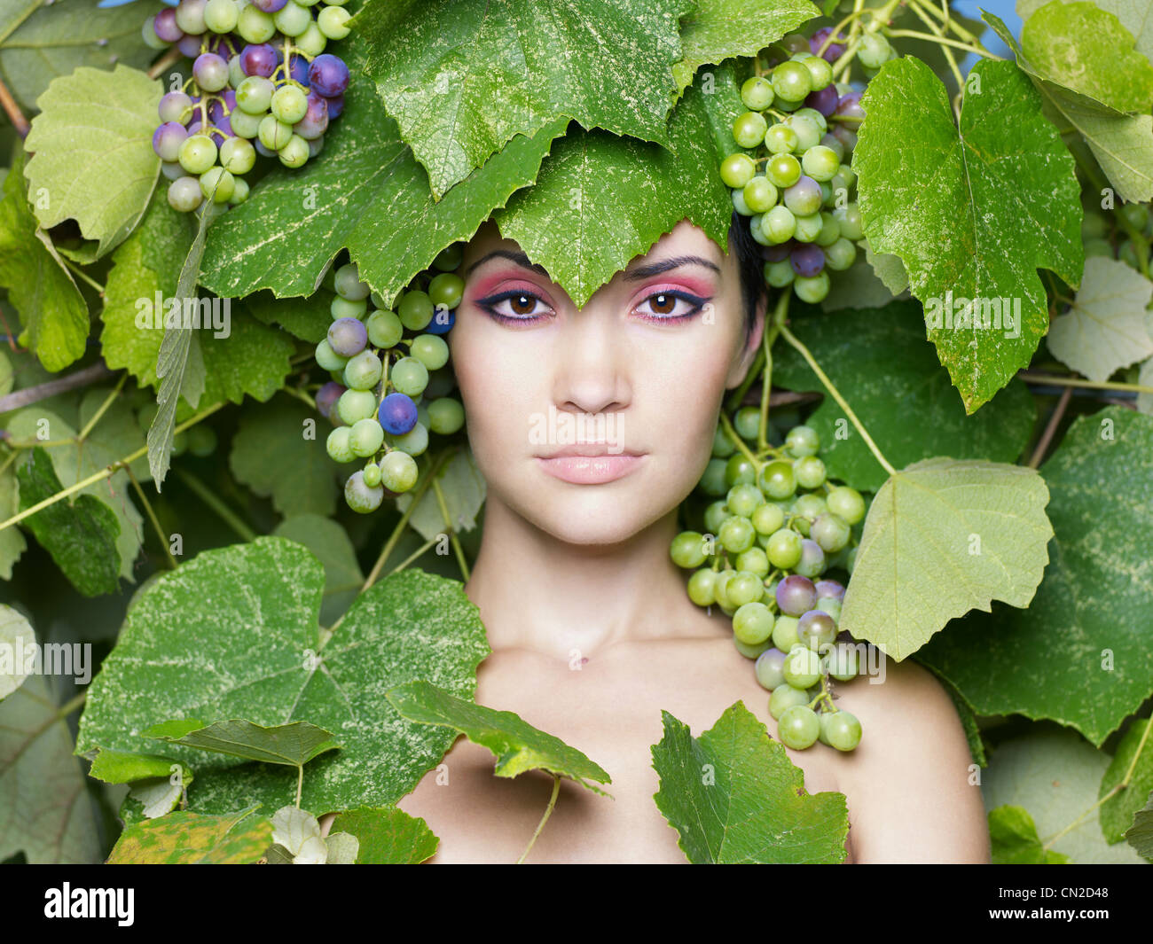 Grape goddess. Beautiful young lady, wrapped in grape Stock Photo - Alamy