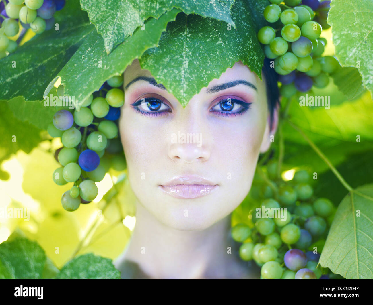 Grape goddess. Beautiful young lady wrapped in grape Stock Photo - Alamy