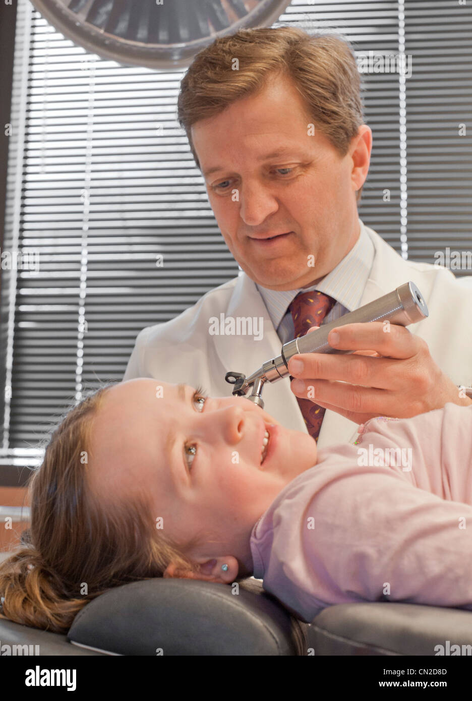 A doctor works with patients at his office Stock Photo - Alamy
