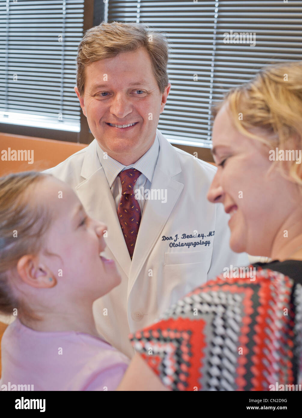 A doctor works with patients at his office Stock Photo - Alamy