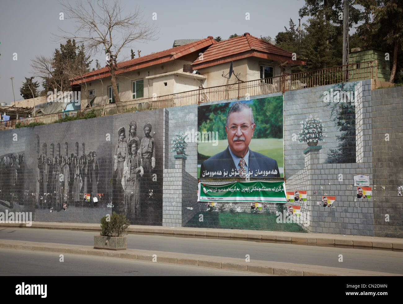 Murals in the city of Sulemania. In front Jalal Talabani. President of ...