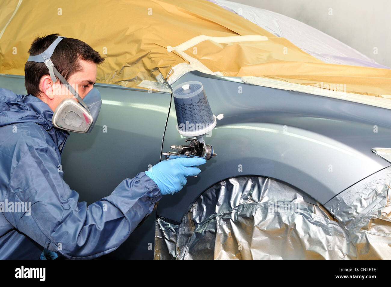 Worker painting a car Stock Photo - Alamy