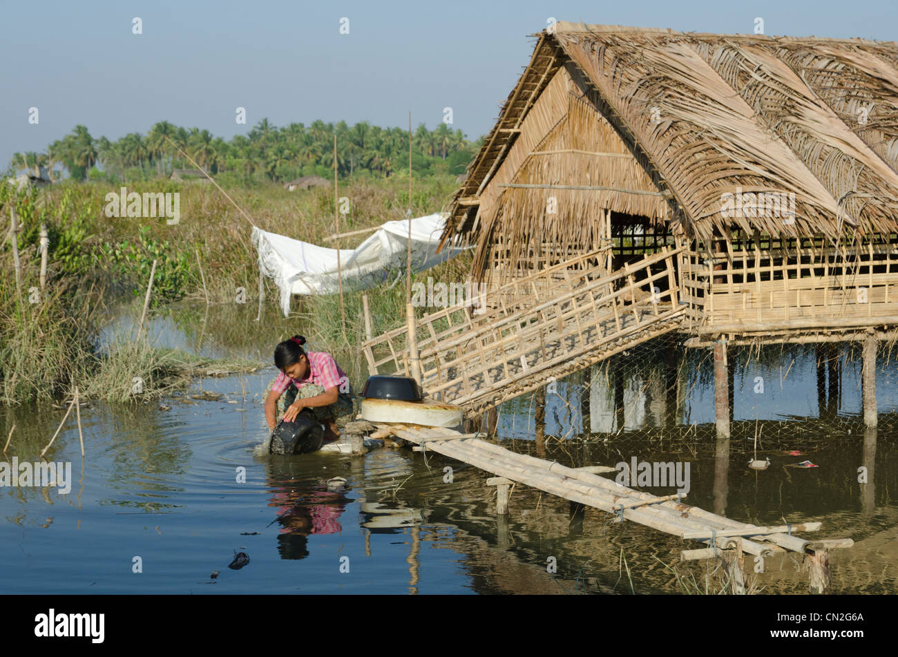 Woman in bamboo hut hi-res stock photography and images - Alamy