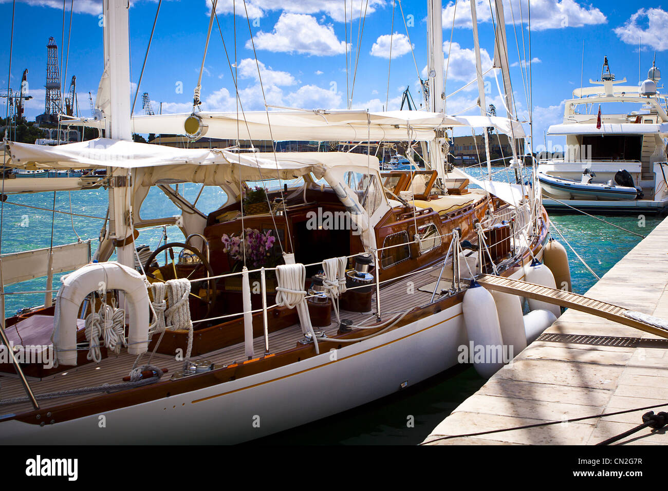A luxury yacht docked in the marina port Stock Photo - Alamy