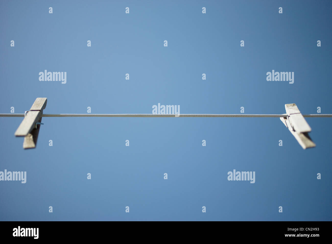 Washing line with two clothes pegs Stock Photo - Alamy