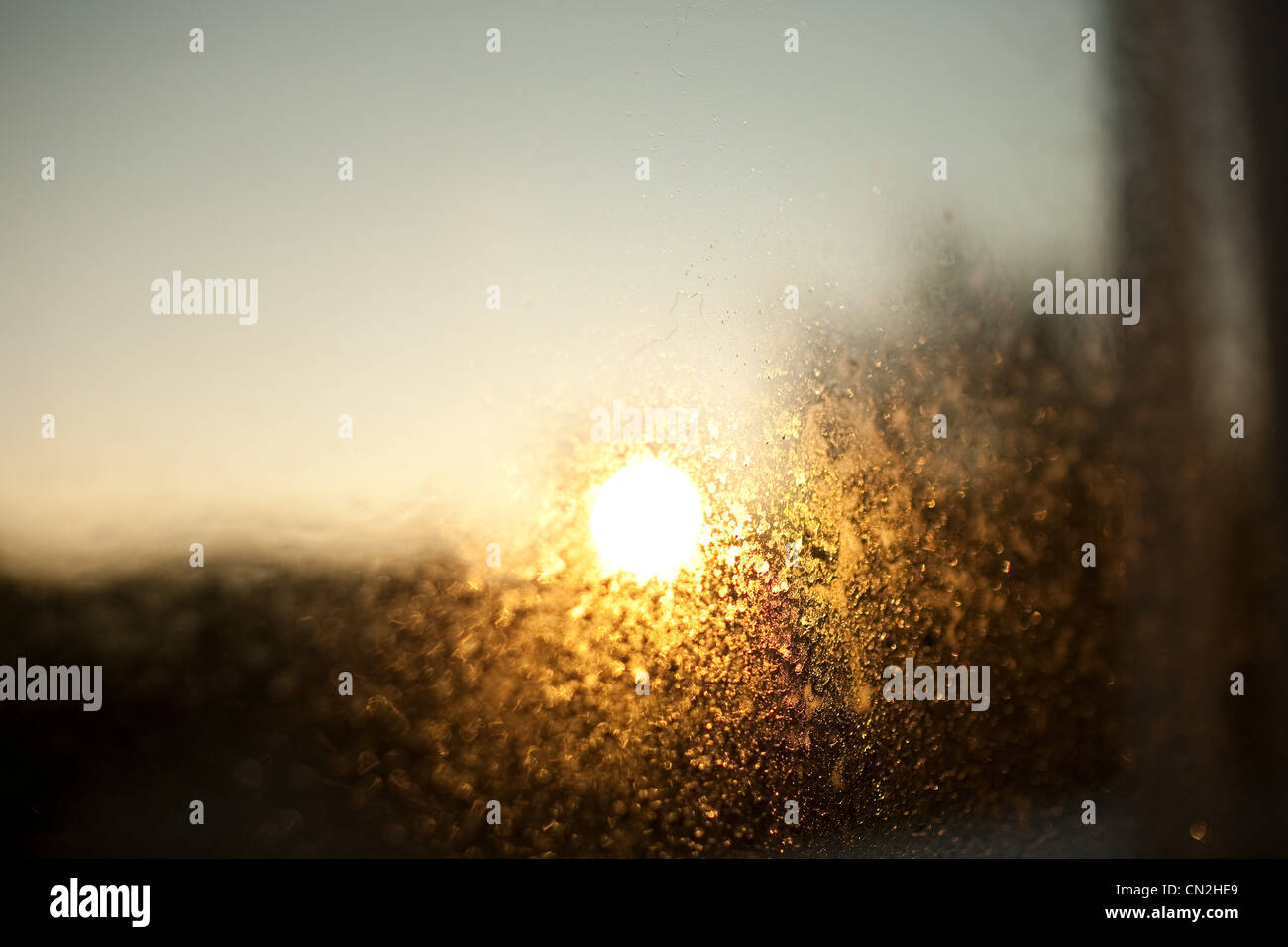View sunset through window Stock Photo - Alamy