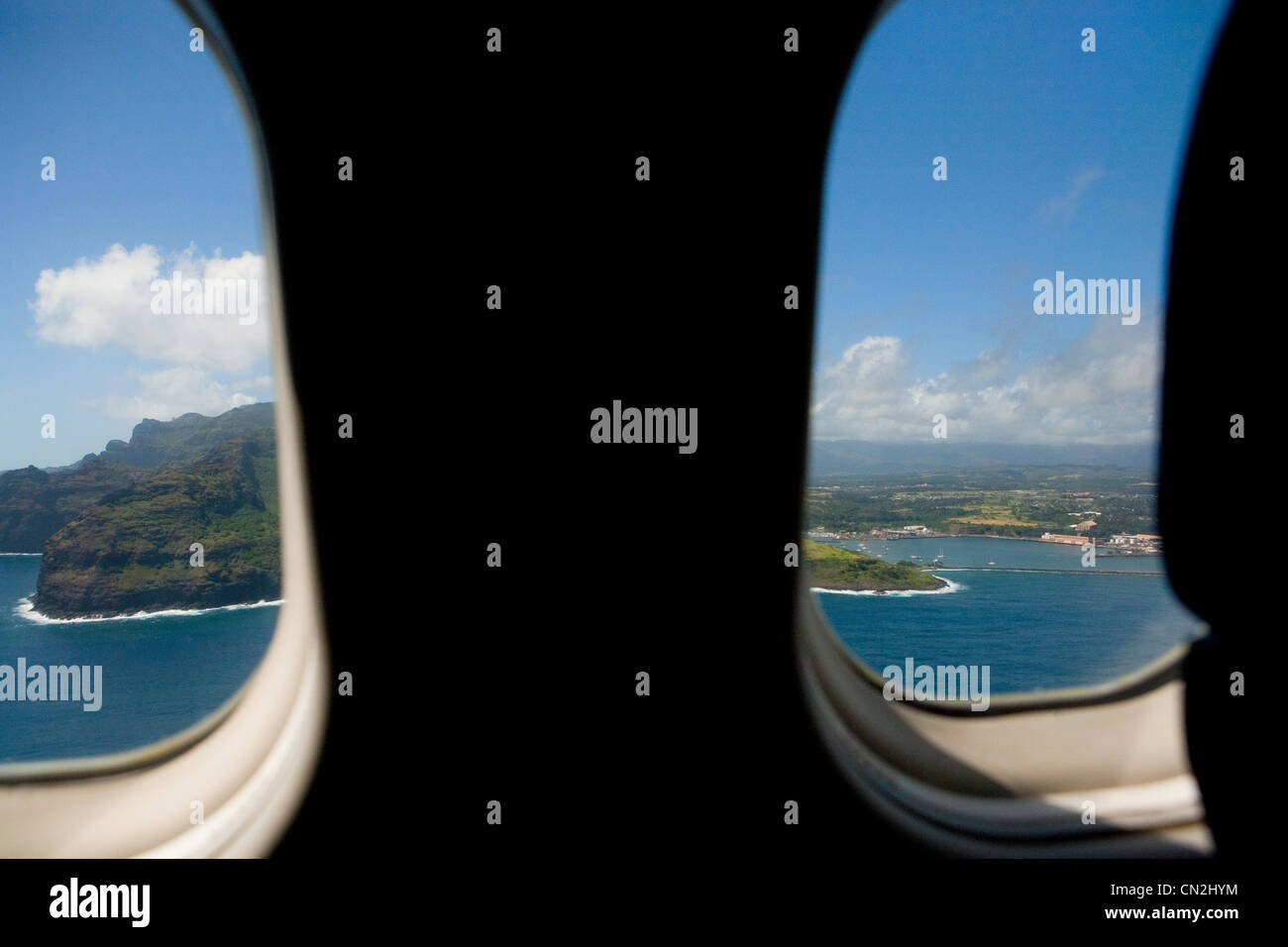 View of tropical island through airplane window Stock Photo - Alamy