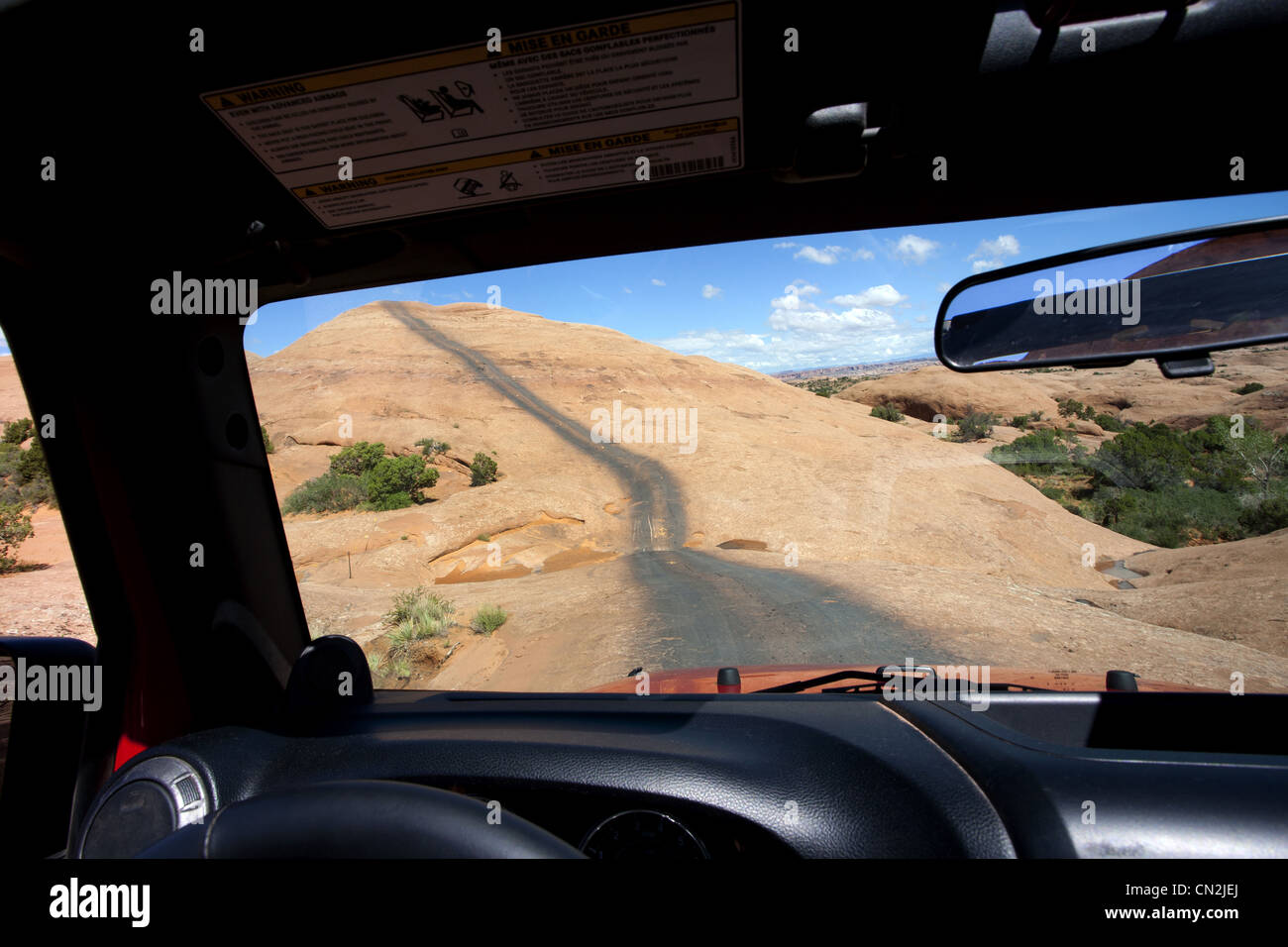 View of Remote Road Across Red Rocks Through Jeep Window, Moab, Utah ...