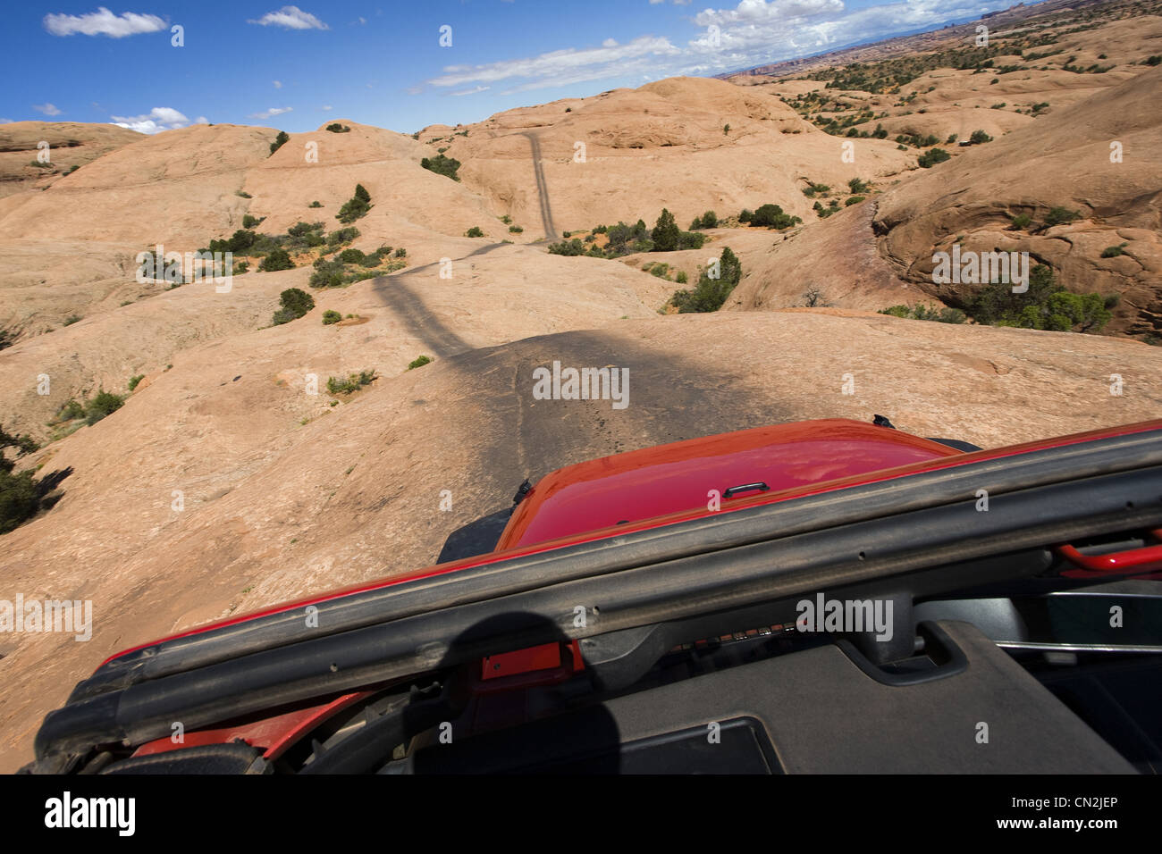 View of Remote Road Across Red Rocks Through Jeep Sunroof, Moab, Utah ...