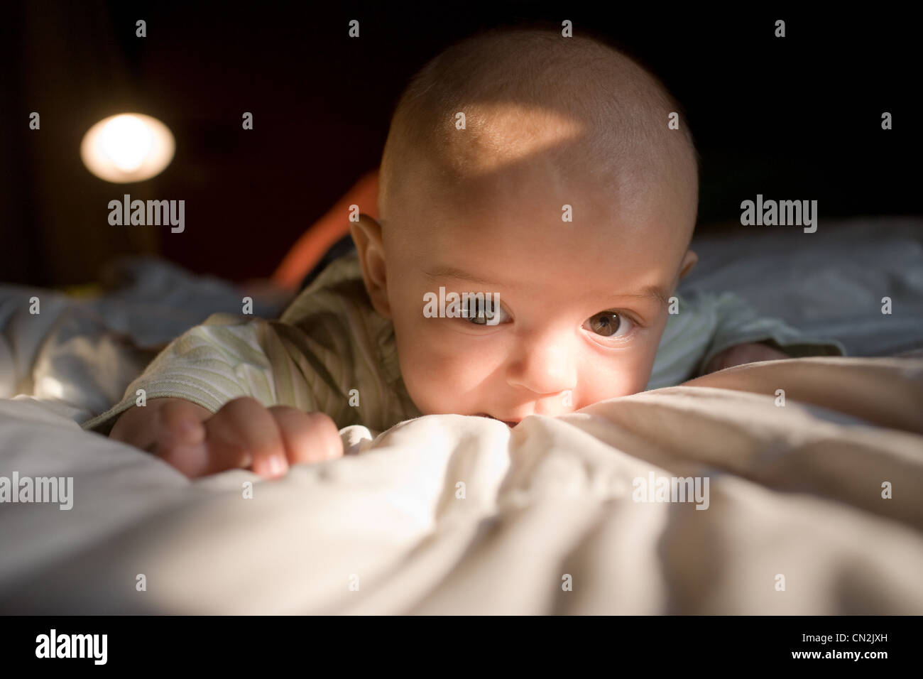 Baby boy lying on front, close up Stock Photo - Alamy