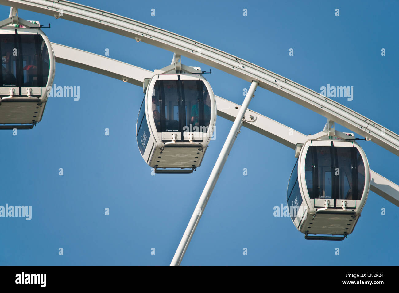 Gondolas up in the air on a big wheel Stock Photo - Alamy