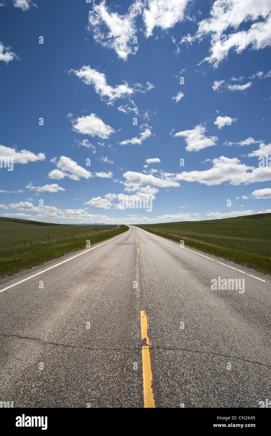 Rural road through green fields hi-res stock photography and images - Alamy