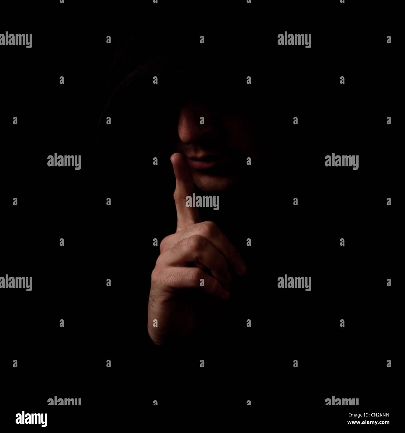 Finger over mouth hi-res stock photography and images - Alamy