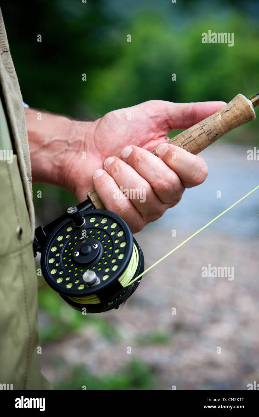 Man holding fishing rod hi-res stock photography and images - Alamy