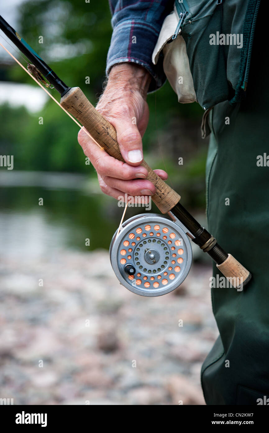 Man holding fishing rod hi-res stock photography and images - Alamy