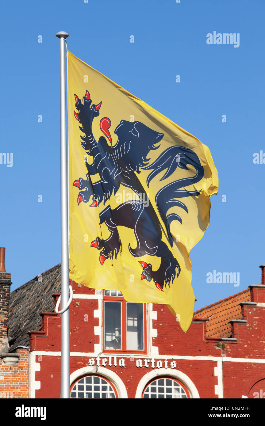 The flag of Flanders flying high over the Market Square in Bruges ...