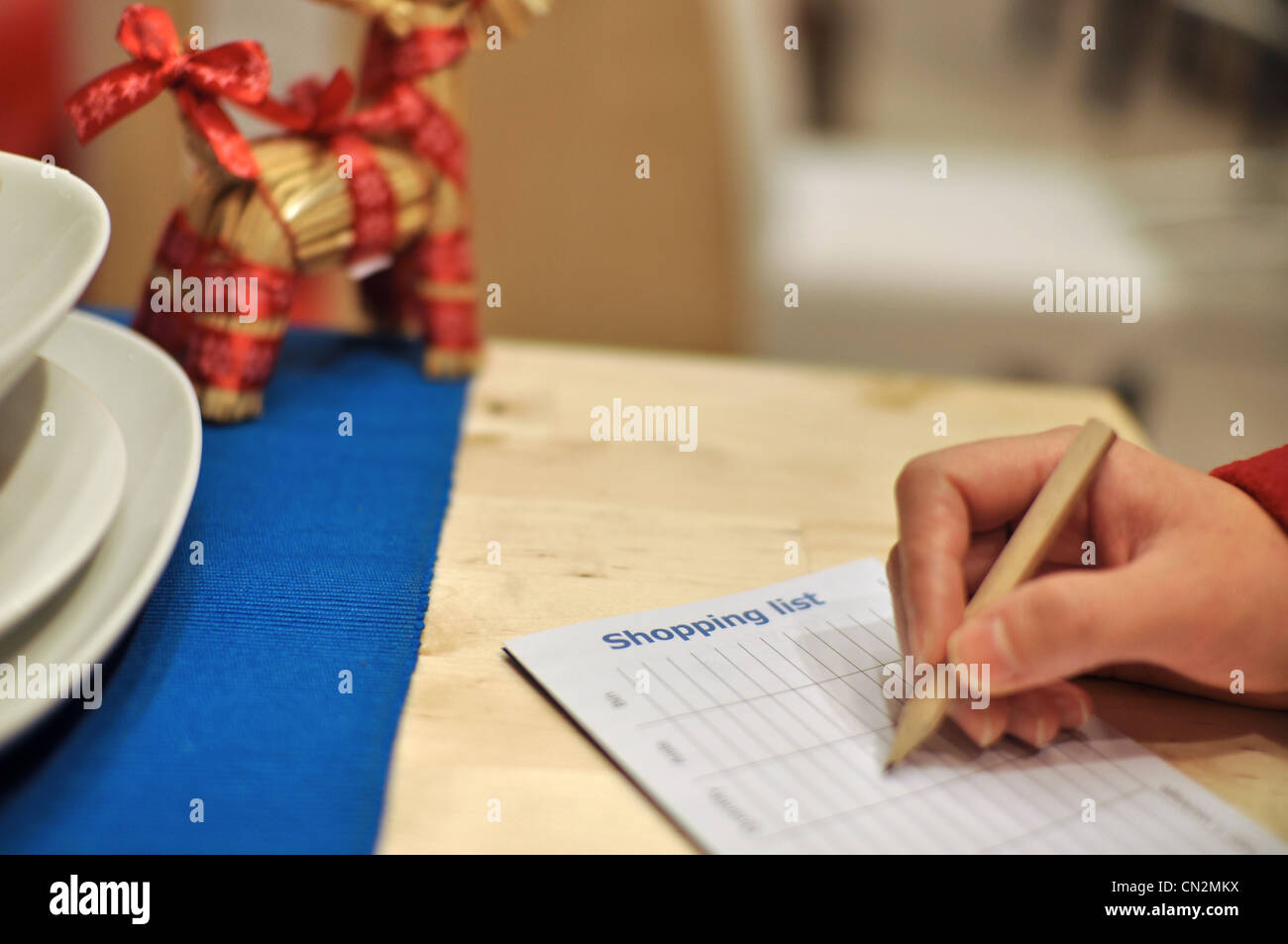 Writing shopping list for xmas season Stock Photo - Alamy