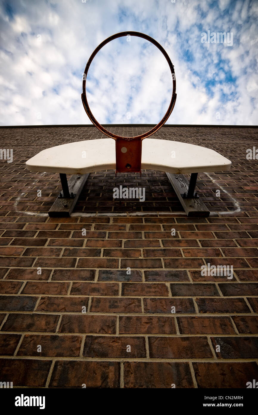 Unusual perspective shot looking up at a netless basketball hoop ...