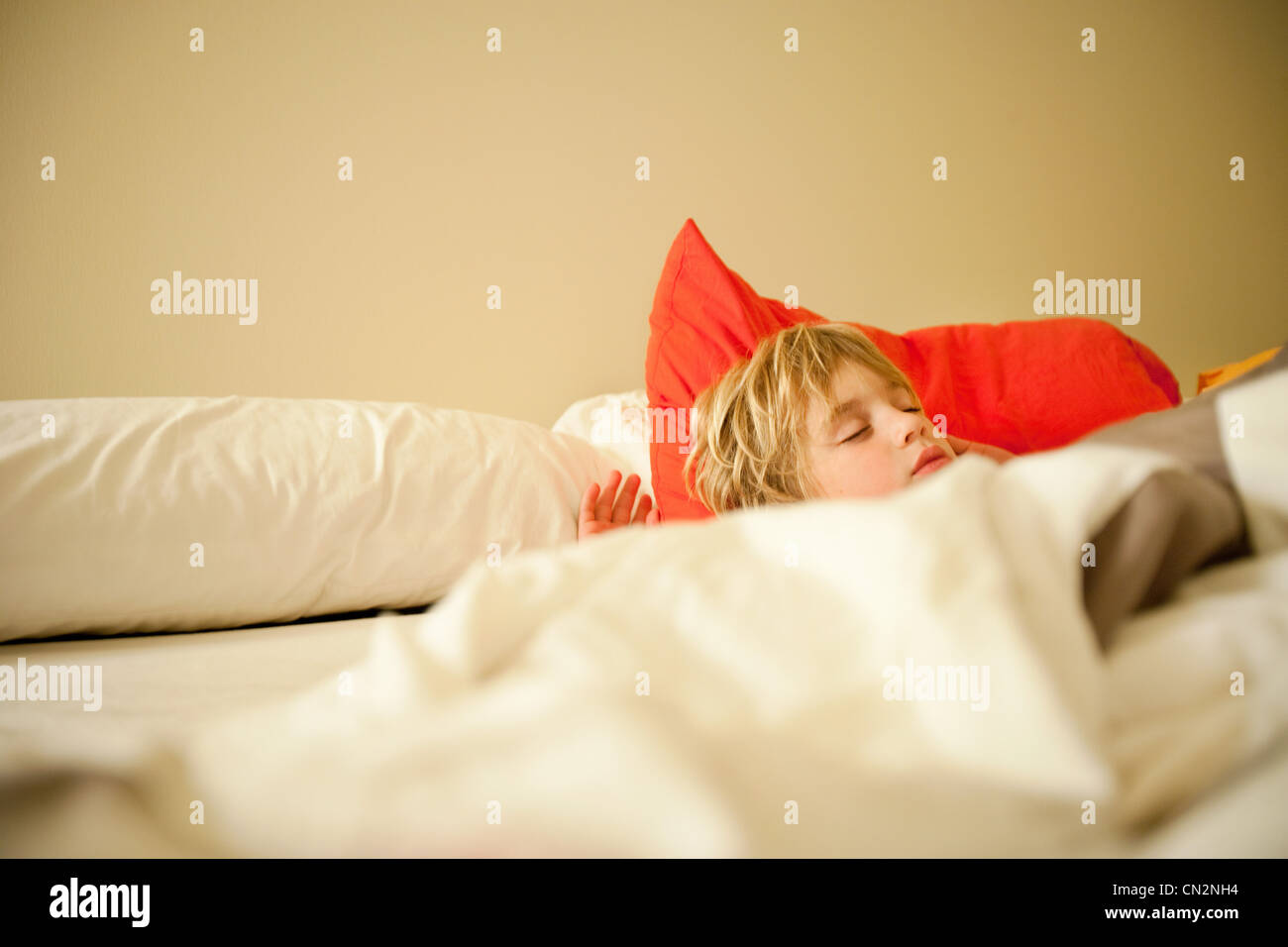Boy asleep in bed Stock Photo - Alamy