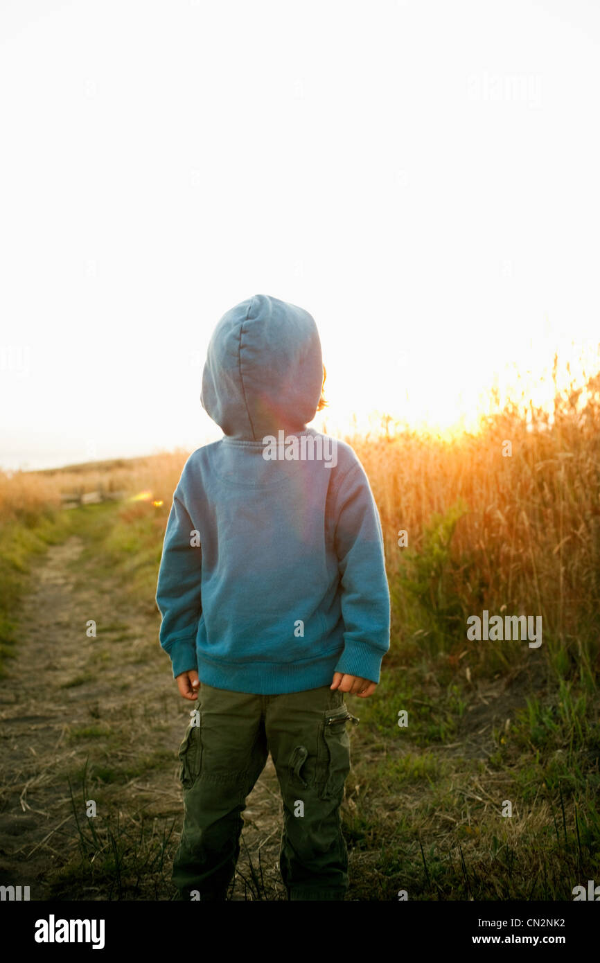 Boy wearing hooded top back to front Stock Photo - Alamy