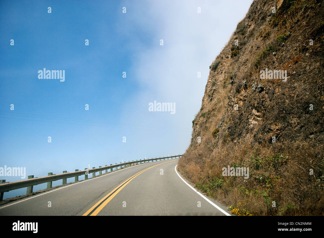 Road and cliff Stock Photo - Alamy