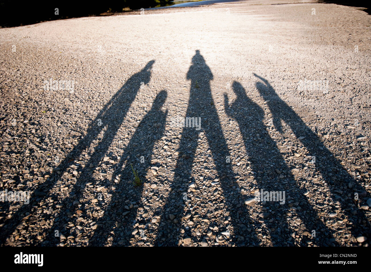 Shadow of family on ground Stock Photo - Alamy