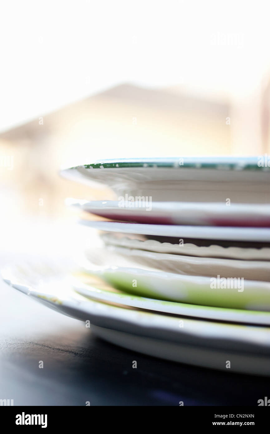 Stack of plates, close up Stock Photo - Alamy