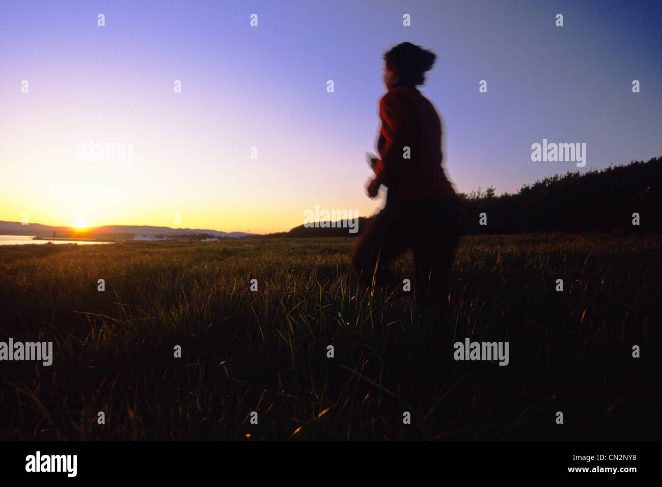 Woman Running through Tall Grass at Sunset, Dallas Road Waterfront ...