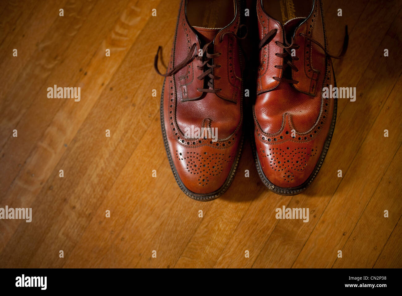 Old brogues on wooden floor hi-res stock photography and images - Alamy