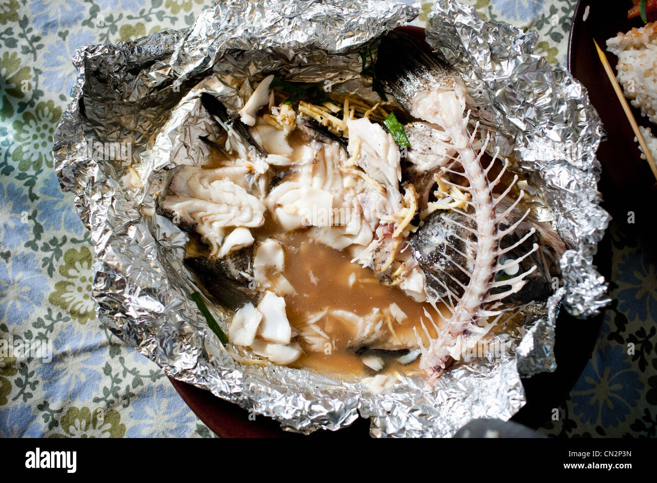 Fish bones in tin foil Stock Photo - Alamy