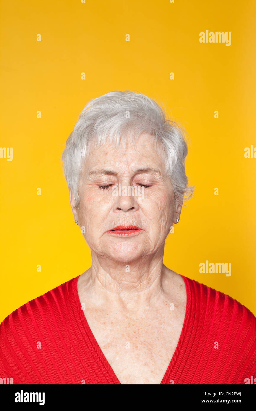 Senior woman with eyes closed, studio shot Stock Photo, Royalty Free ...