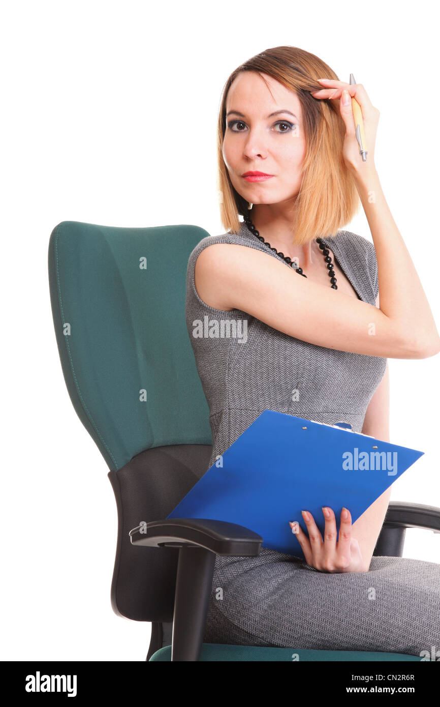 Full length of young business woman sitting on the chair holding ...